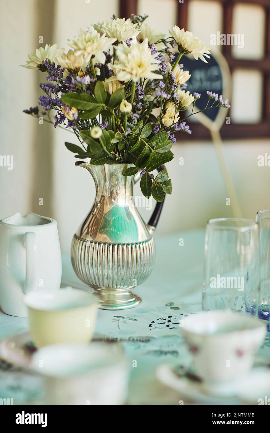 What is a classy party without a vase of flowers. a metal vase filled ...