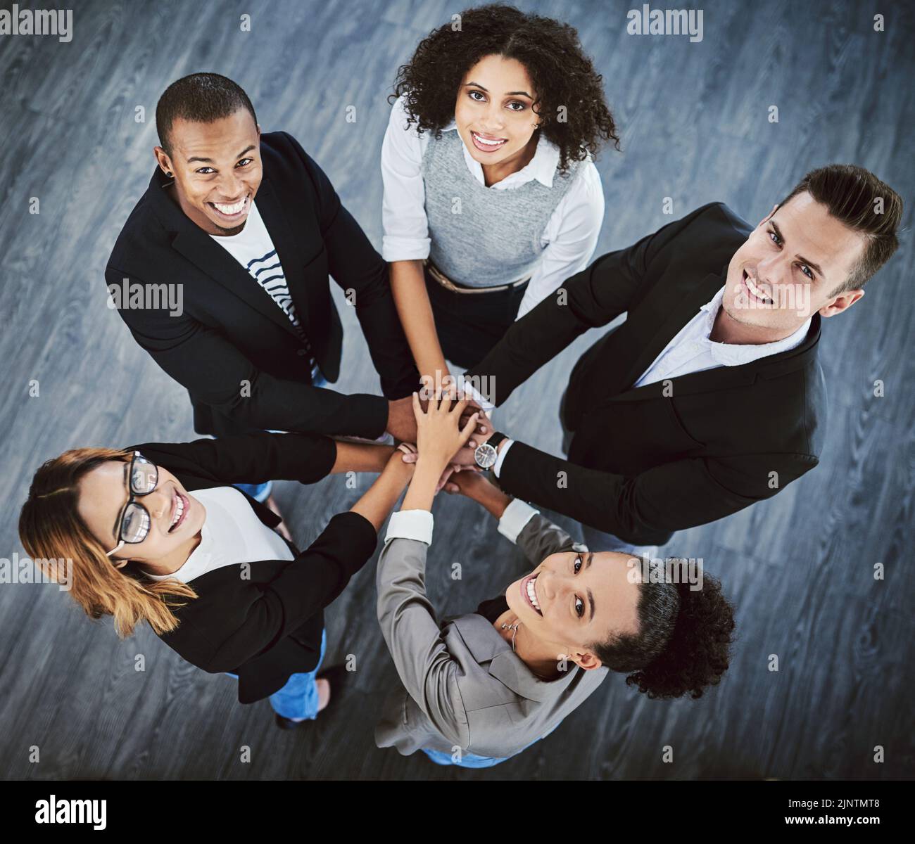 We always aim high. High angle shot of a group of businesspeople ...