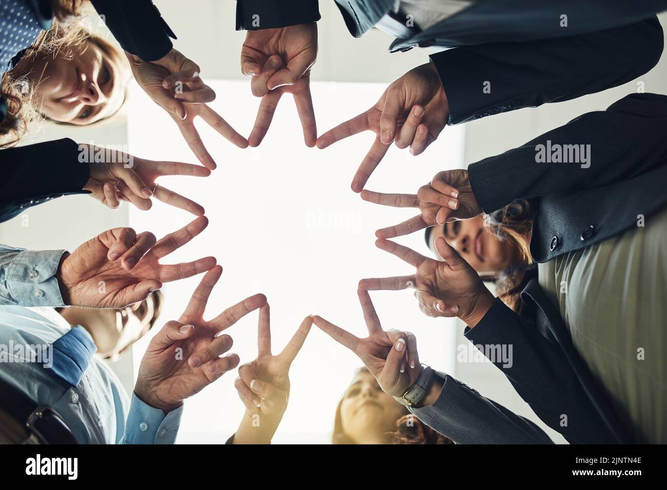 The five star team in business. Low angle shot of a group of young ...