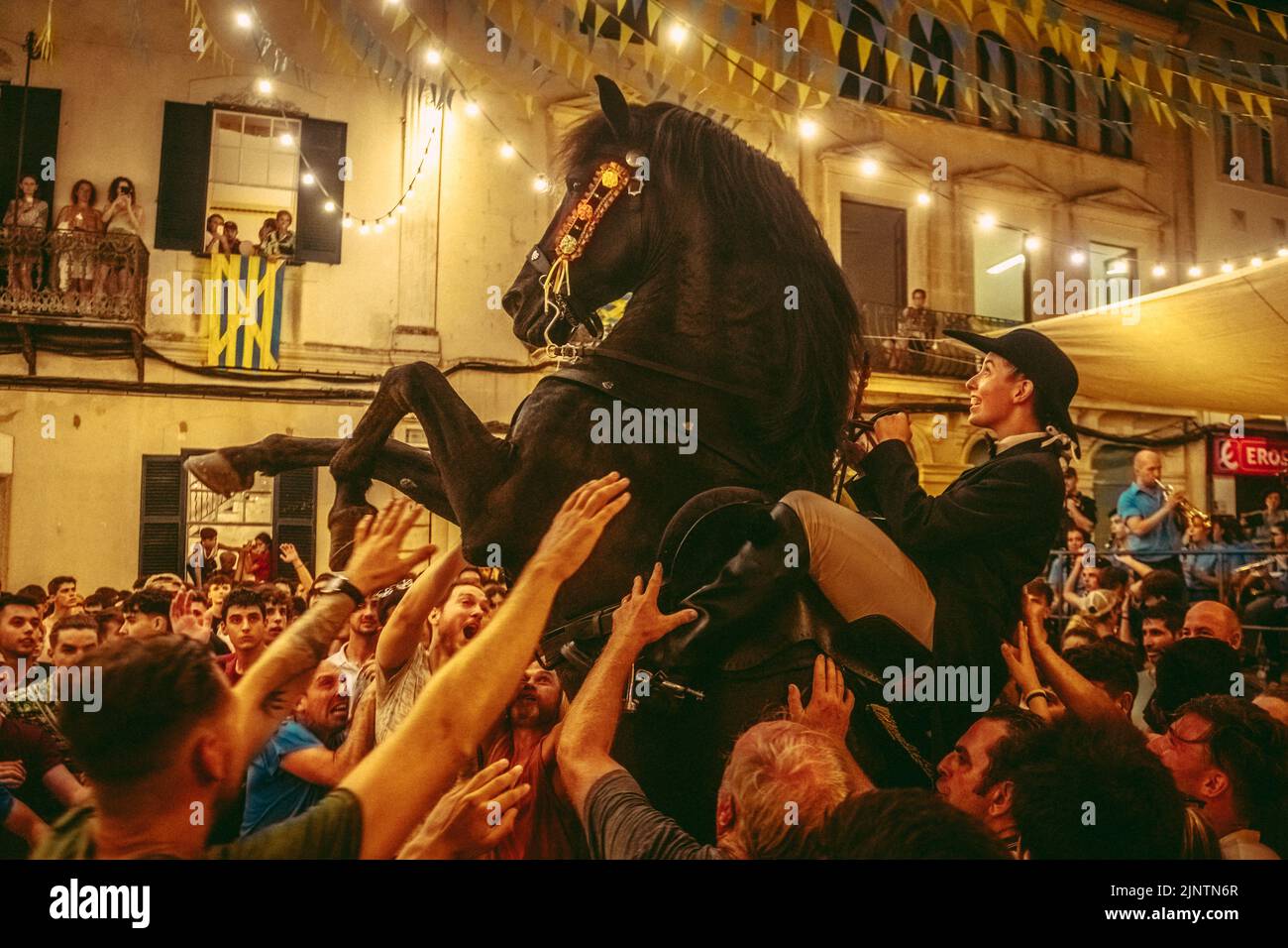 Alaior, Spain. 13th Aug, 2022. A 'caixer' (horse rider) rears up on his ...