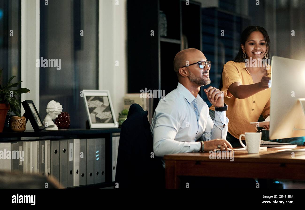 Diverse business people designing on computer, talking in meeting and ...