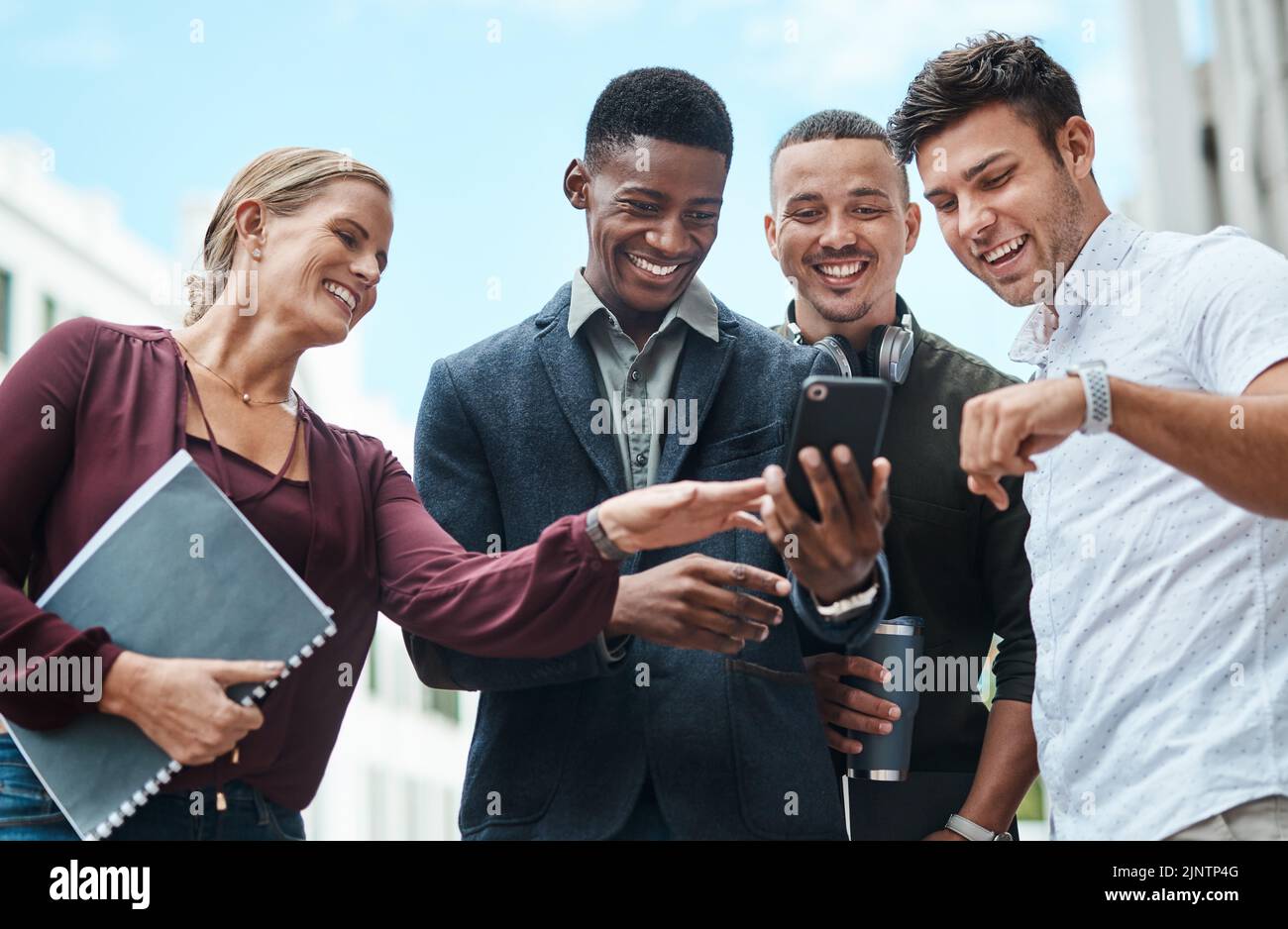 Young, diverse and creative design team and their manager looking at ...