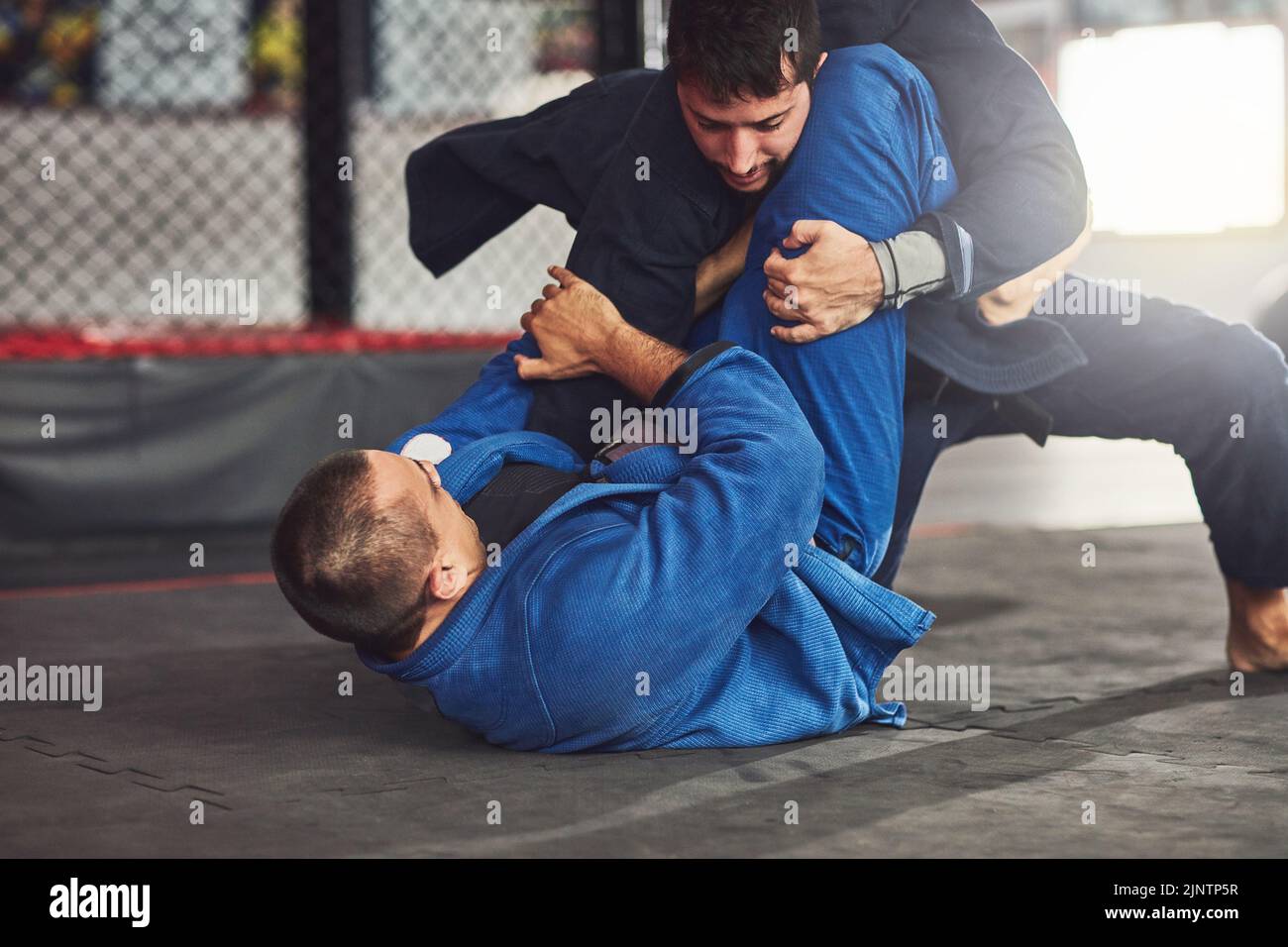 Moves and counter moves. two professional fighters sparring in the gym ...