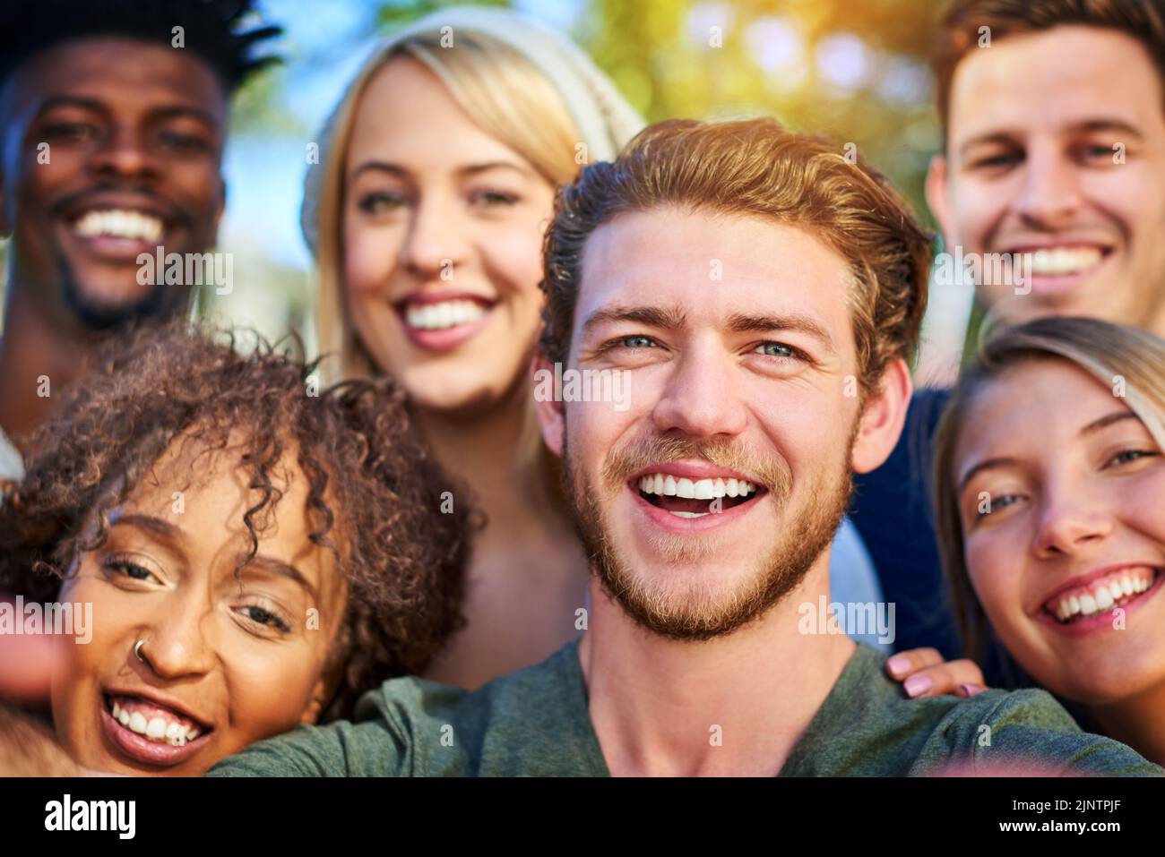 Second year here we come. Portrait of a group of students hanging out ...