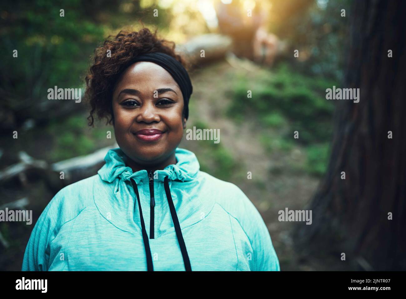 Dedicated to get fit. Portrait of a sporty young woman ready to workout ...
