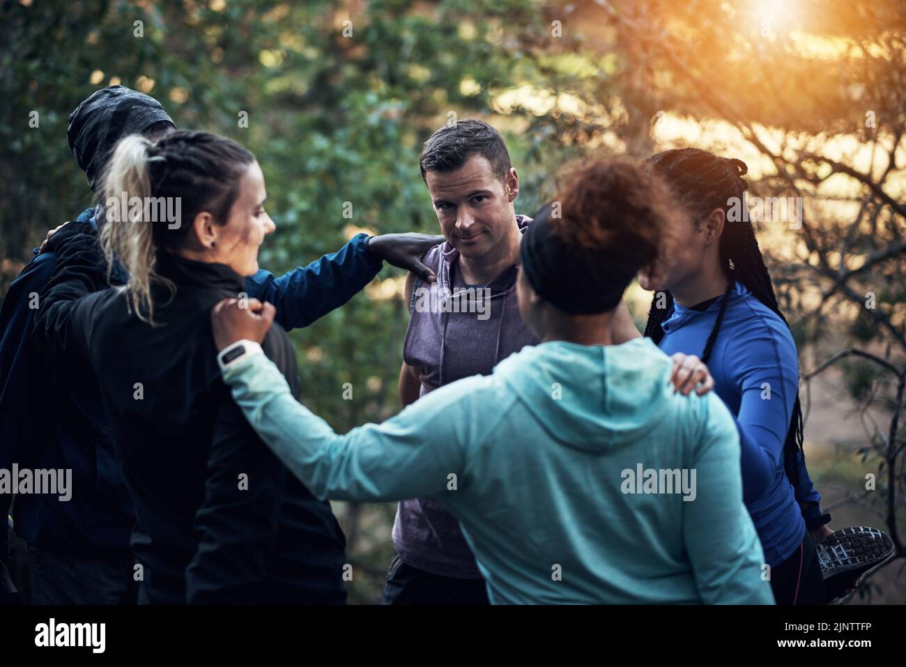 We lift each other up, we help each other. a sporty young group of ...