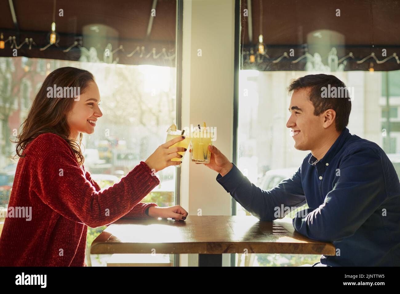 Heres to getting to know each other better. a young man and woman ...