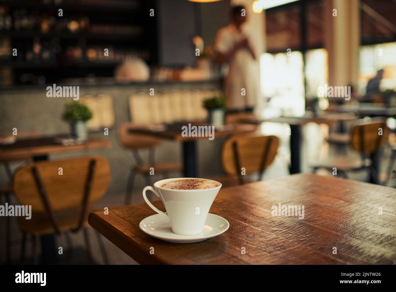 Can anyone see me. a freshly brewed cup of coffee standing on a table ...