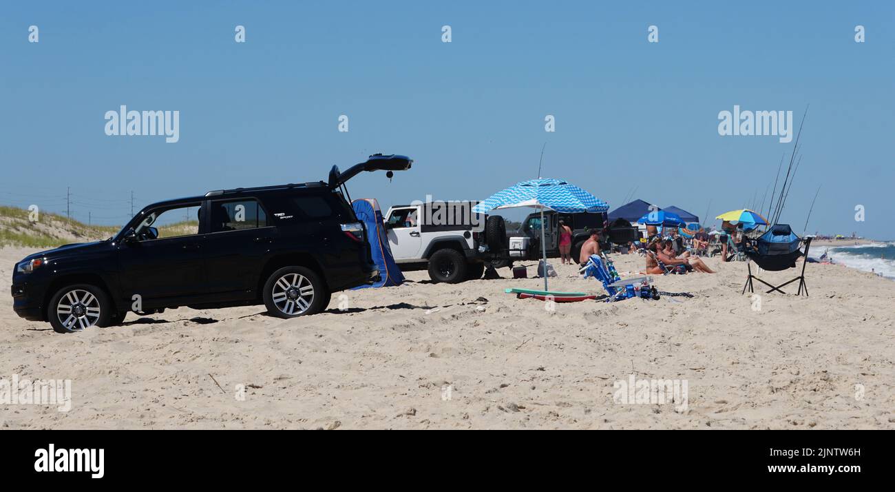 Dewey Beach, Delaware, U.S.A - August 13, 2022 - The trucks with tags parked on the surf fishing ...