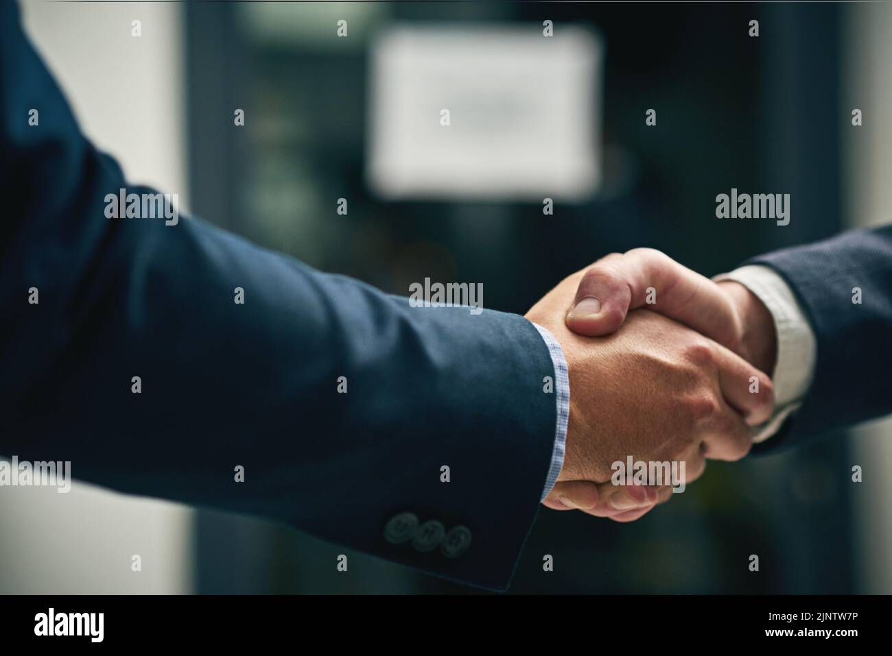 Handshake, deal and successful merger closeup after agreement ...