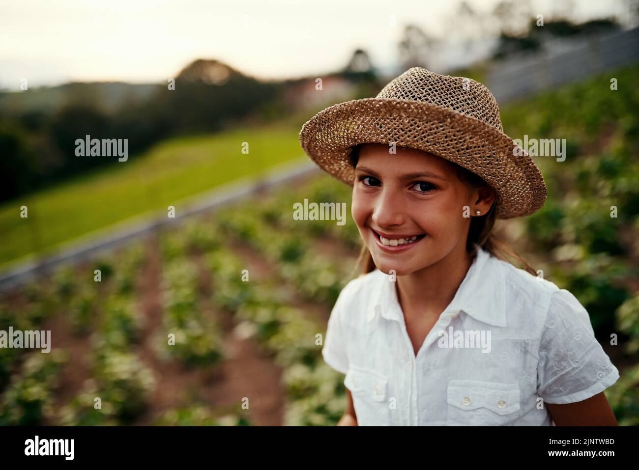 I love working on the farm. Cropped portrait of a little girl standing ...