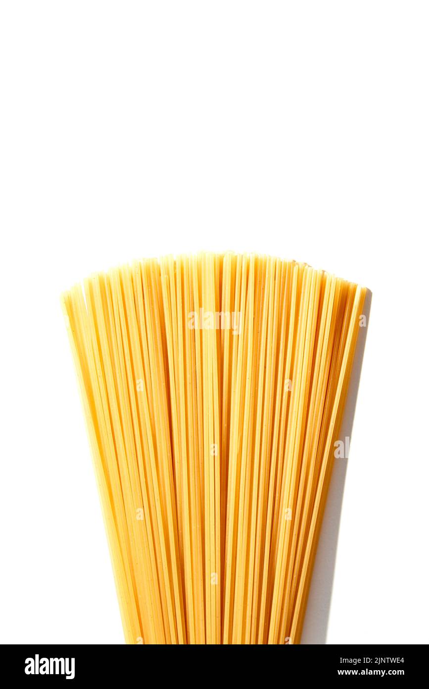 Italian food concept, bunch of raw long pasta, spaghetti, on white ...