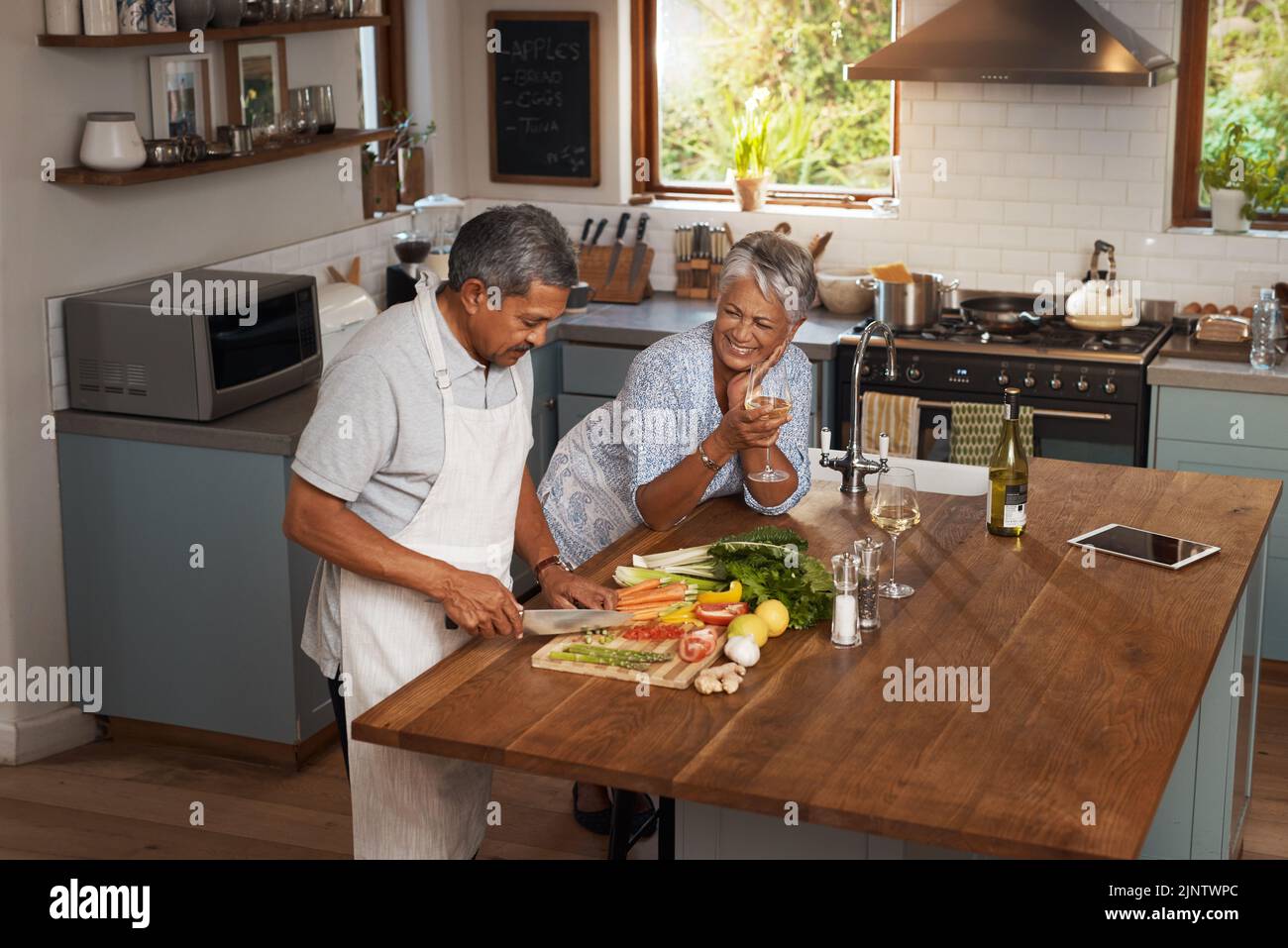 Cooking should be a leisurely experience. a happy mature couple ...