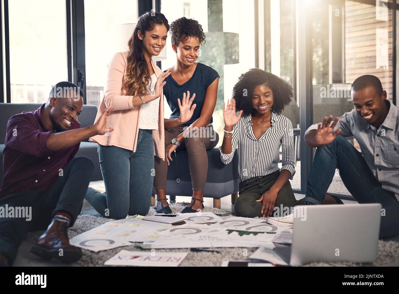 Connected across the globe. a group of young entrepreneurs going ...