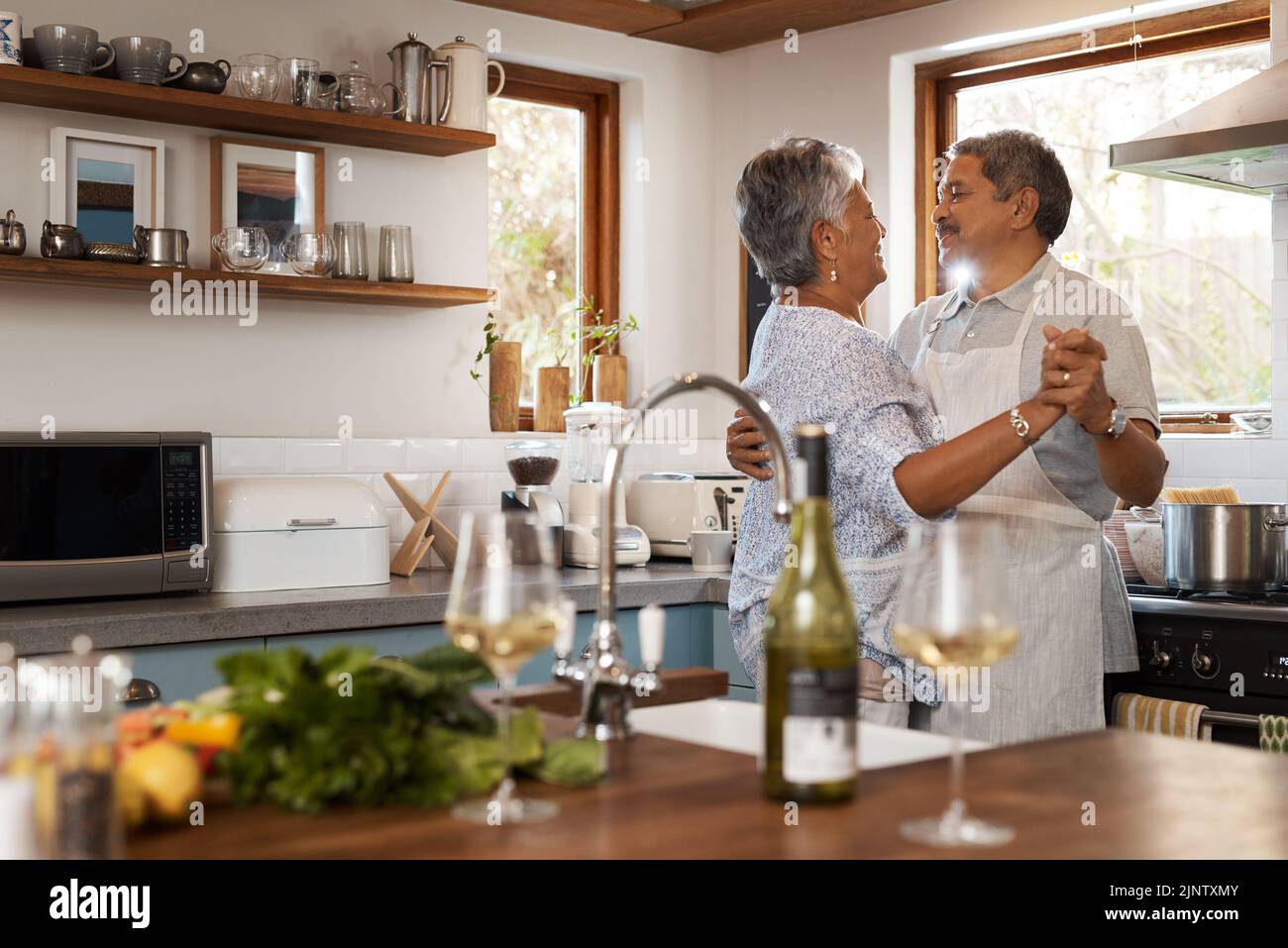 Fall in love all over again. a happy mature couple dancing together ...