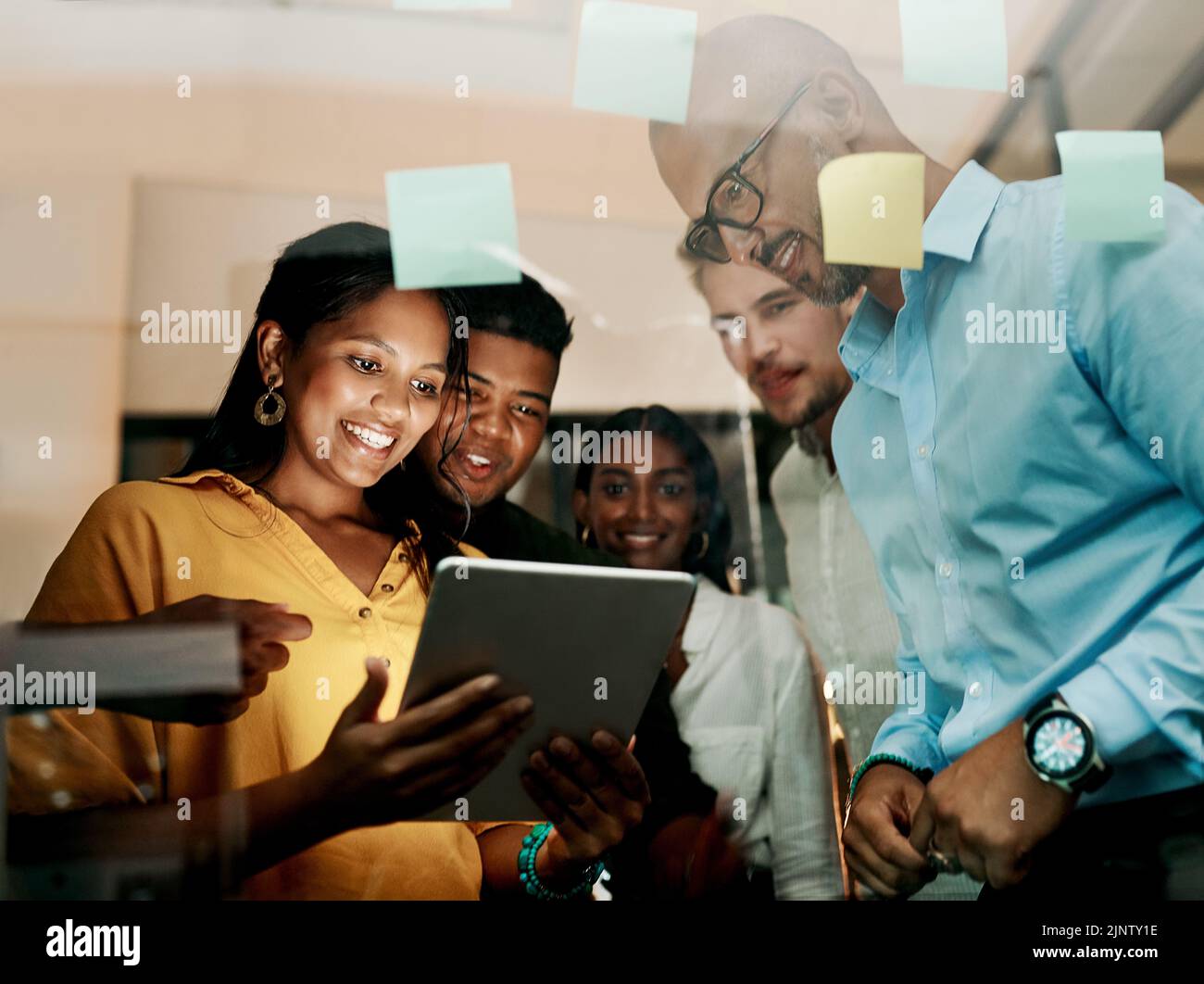 Group of creative, excited and smiling design team, working ...