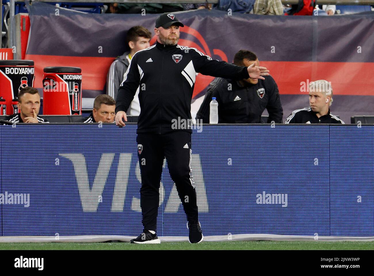 FOXBOROUGH, MA - AUGUST 13: DC United head coach Wayne Rooney directs ...