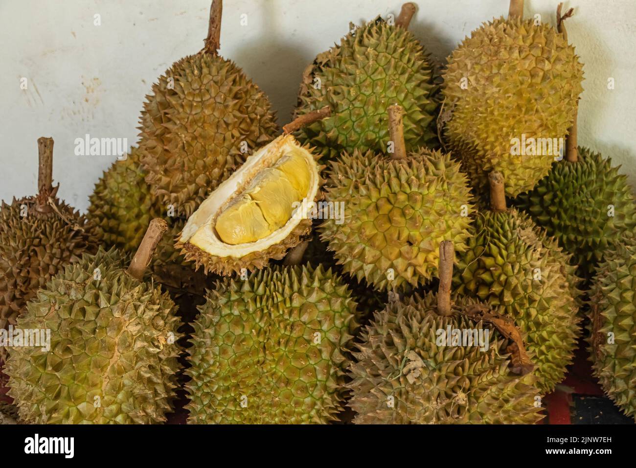 A pile of thorny durians with it's ripe, edible pulp Stock Photo - Alamy