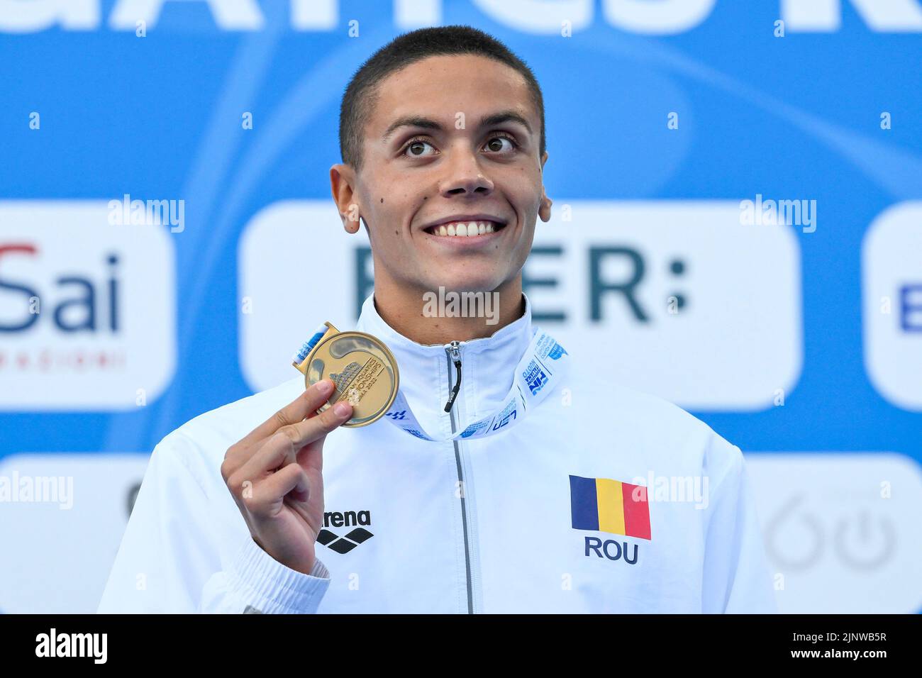 David Popovici of Romania shows the medal after compete in the 100m ...