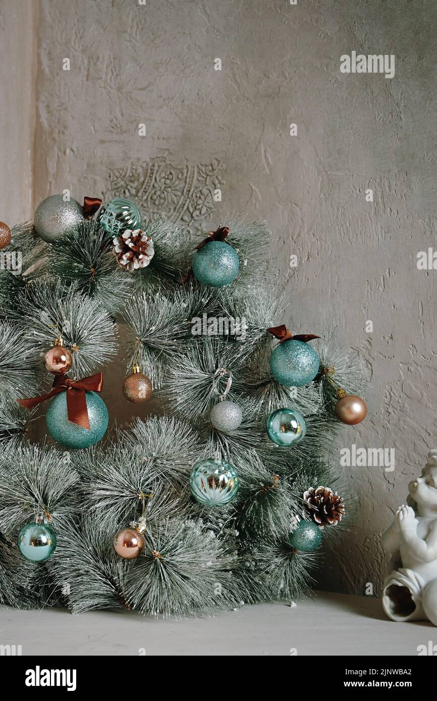 Christmas light blue wreath on a concrete wall background Stock Photo ...