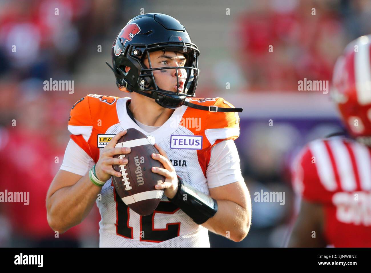 BC Lions quarterback Nathan Rourke looks downfield during second half CFL football action ...