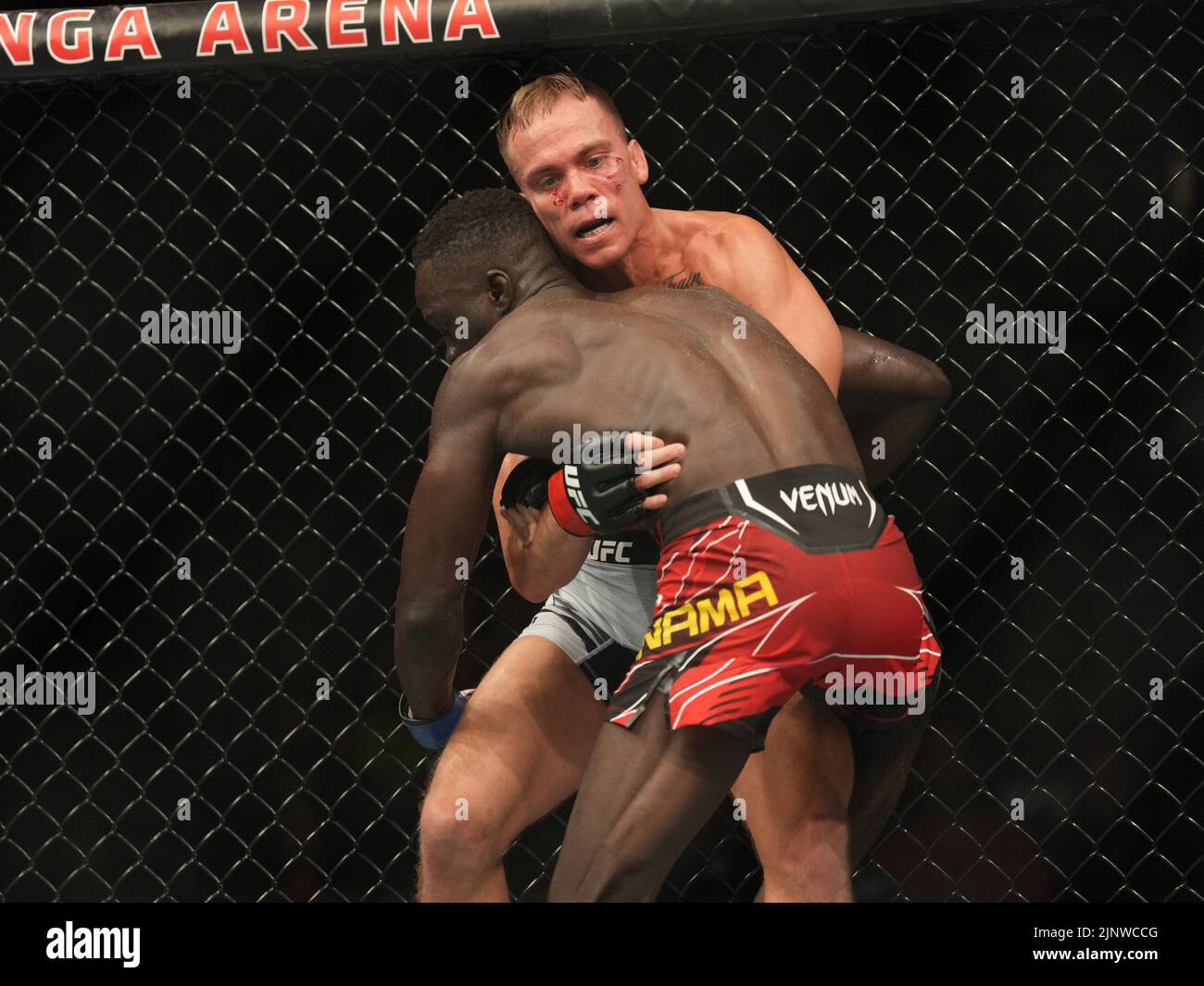 SAN DIEGO, CA - AUGUST 13: (R-L) David Onama (top) controls the body of ...