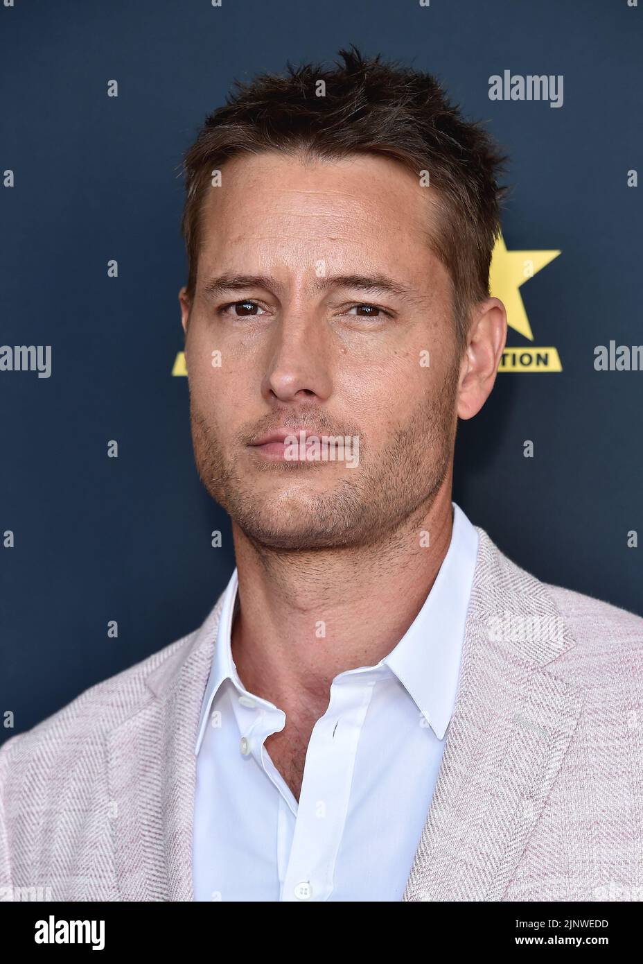 Justin Hartley walking on the red carpet at the The 2nd Annual HCA TV ...