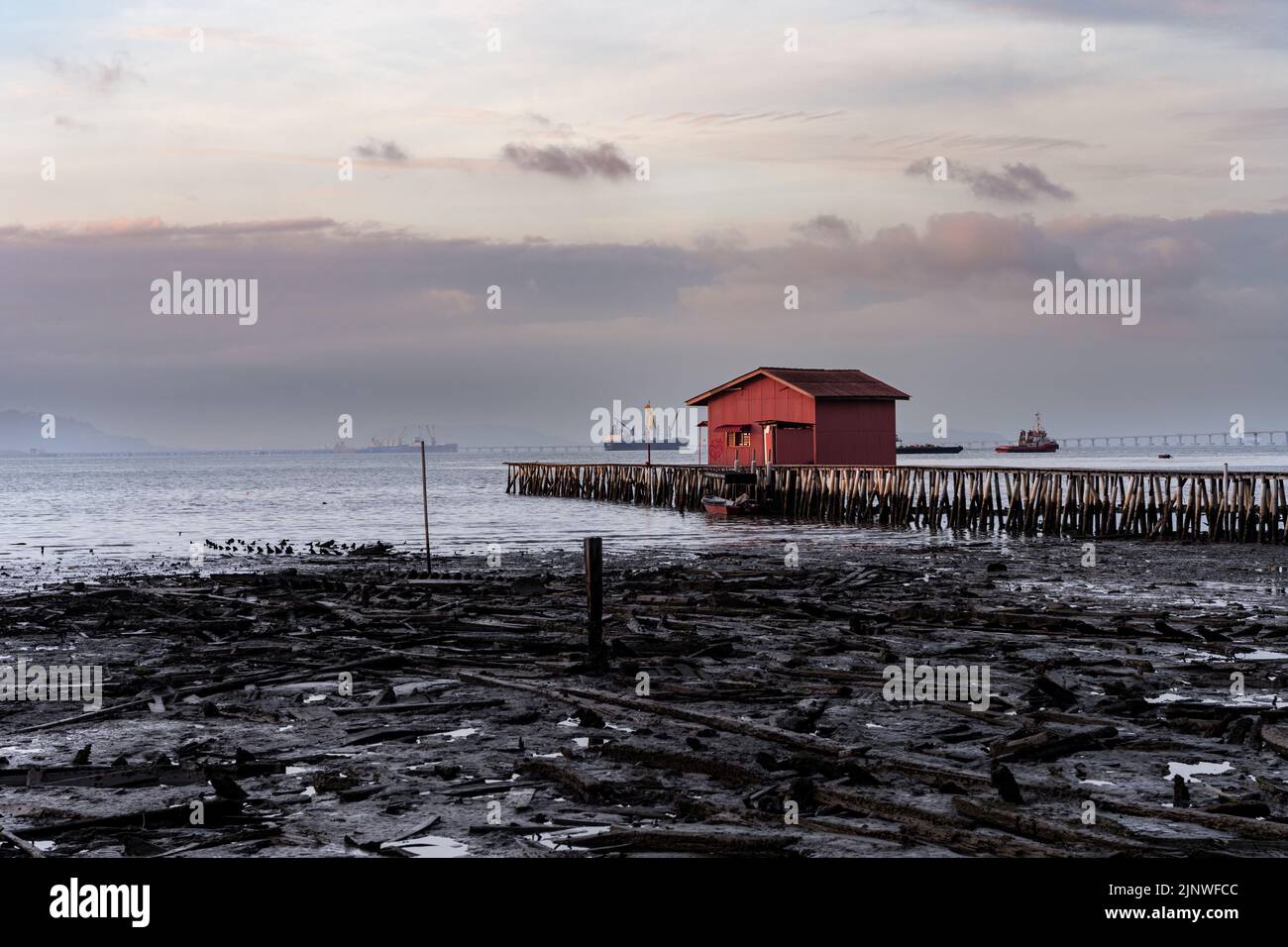 Sunrise view of wooden bridge and red house background at Clan Tan ...