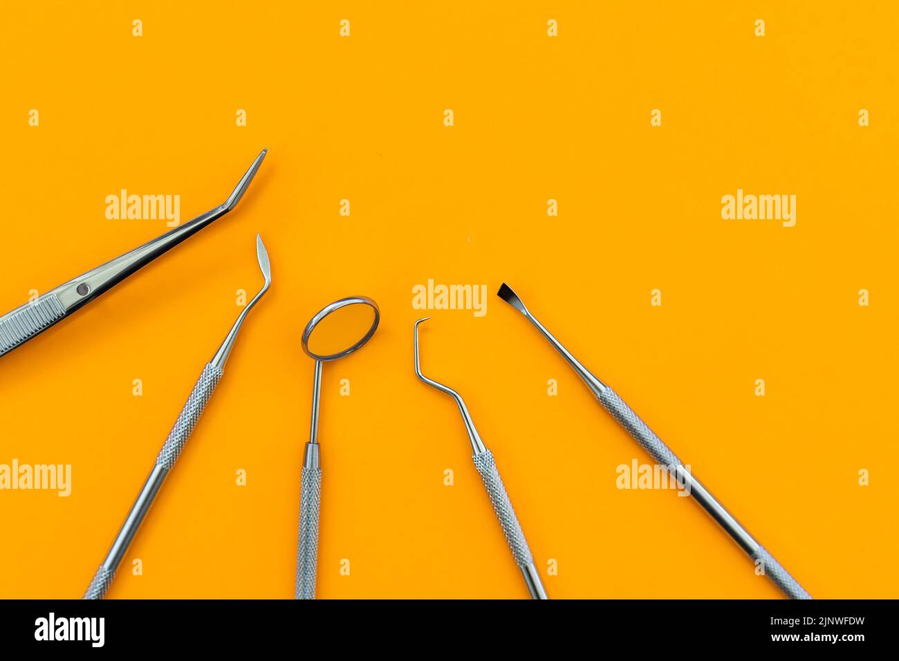 Professional Dentist tools in dental office: dentist mirror, forceps ...