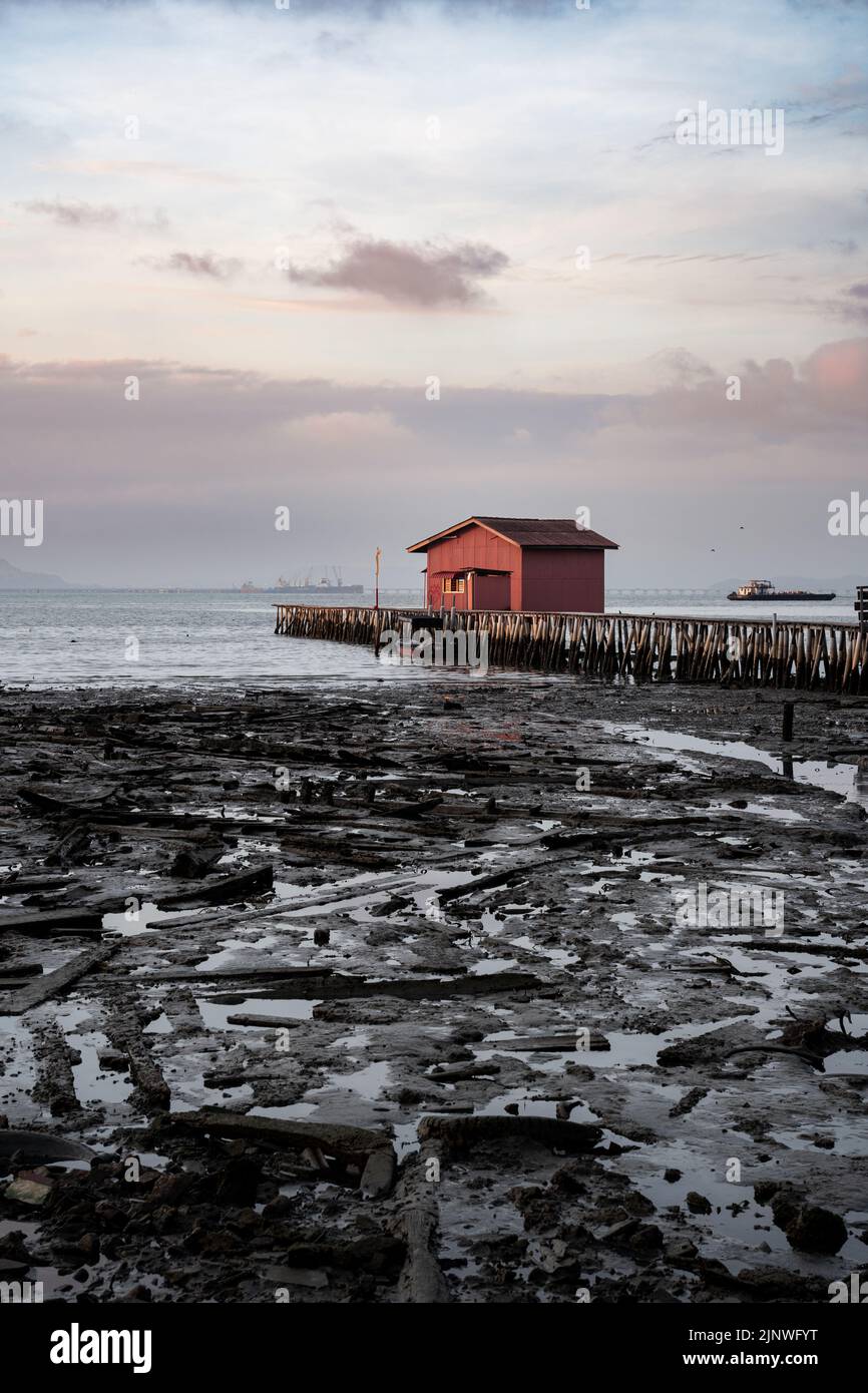 Sunrise view of wooden bridge and red house background at Clan Tan ...
