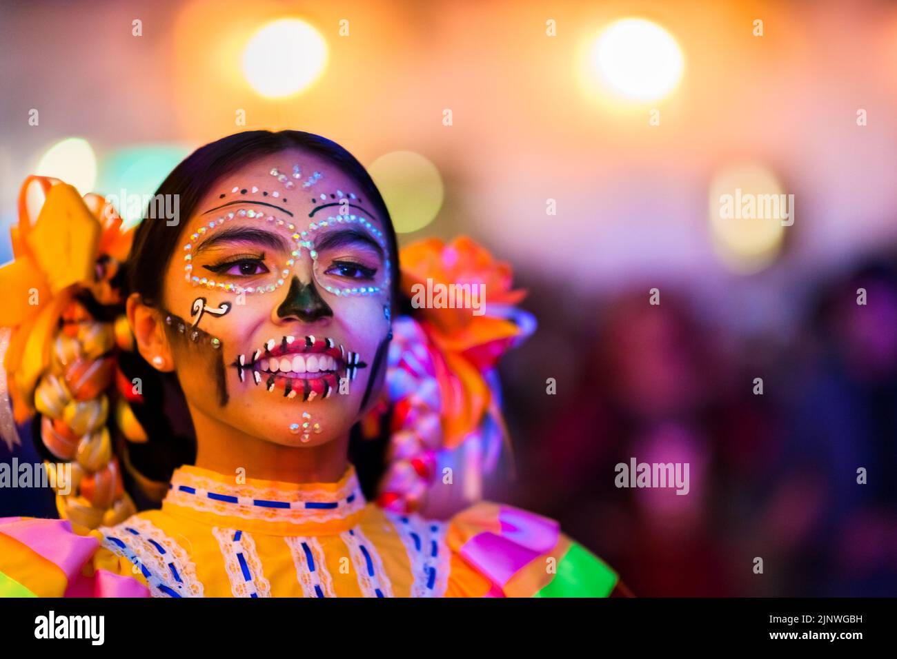 A Mexican girl, dressed as La Catrina, a Mexican pop culture icon ...