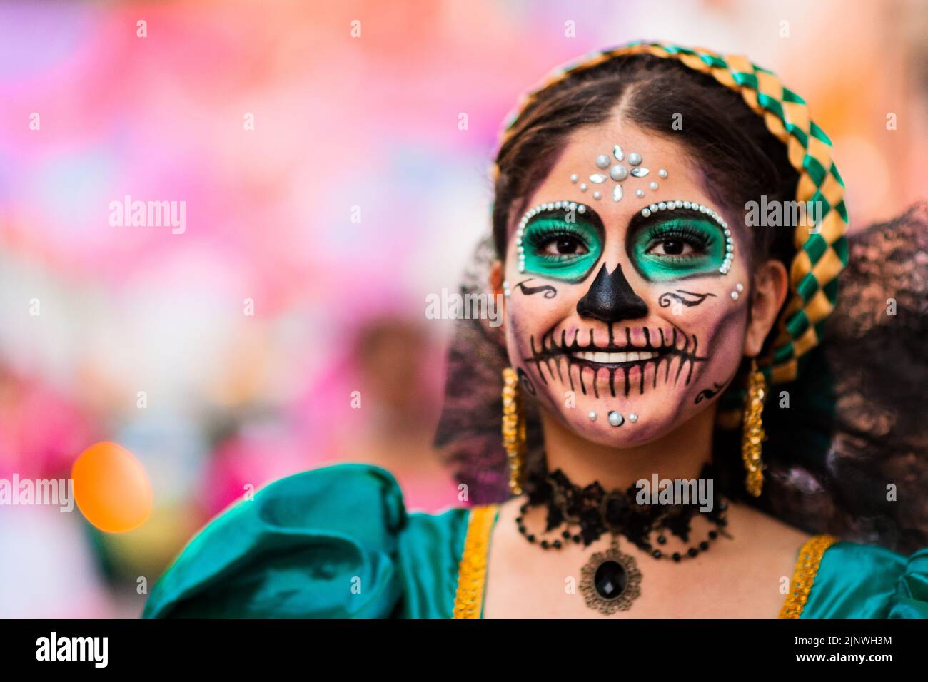 A Mexican girl, dressed as La Catrina, a Mexican pop culture icon ...