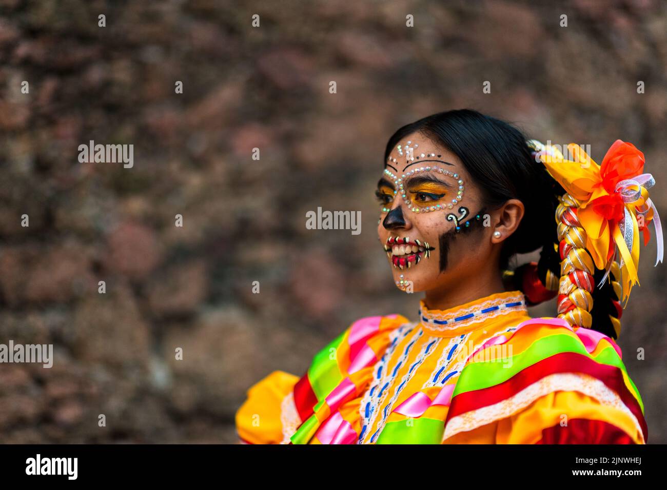 A Mexican girl, dressed as La Catrina, a Mexican pop culture icon ...