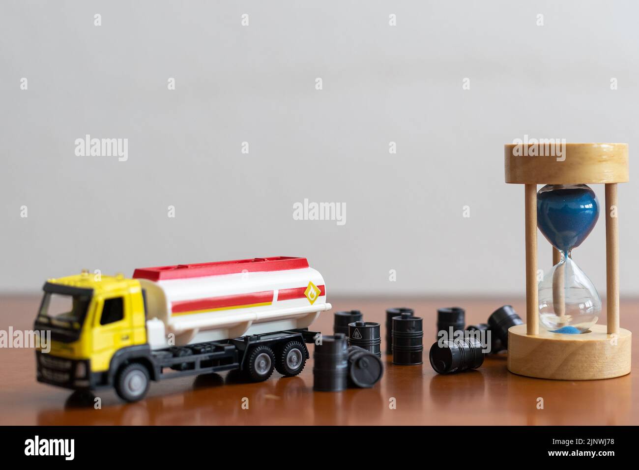 small toy combine with toy oil barrel Stock Photo - Alamy