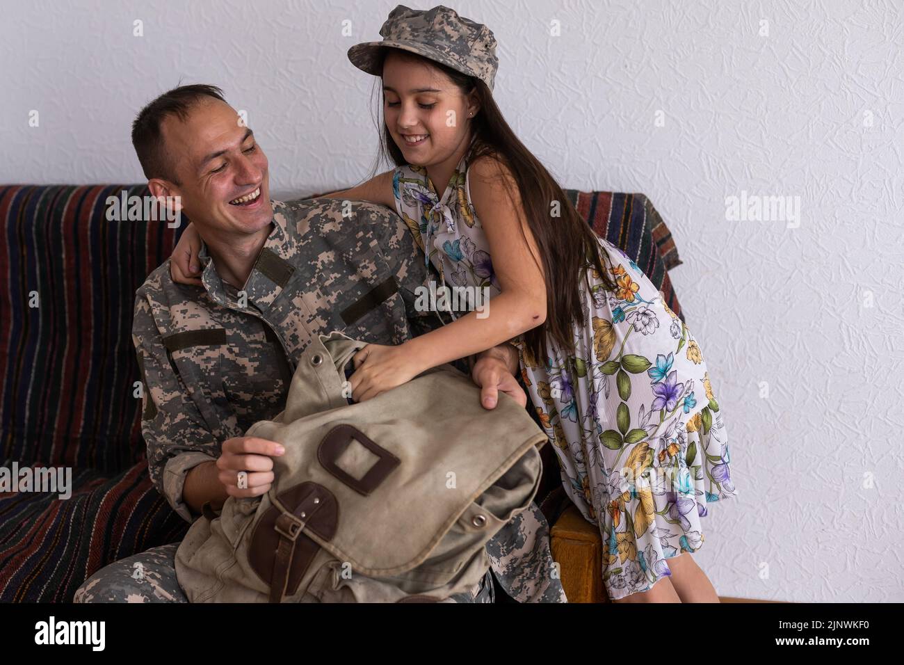 Affectionate military father with daughter at home Stock Photo - Alamy