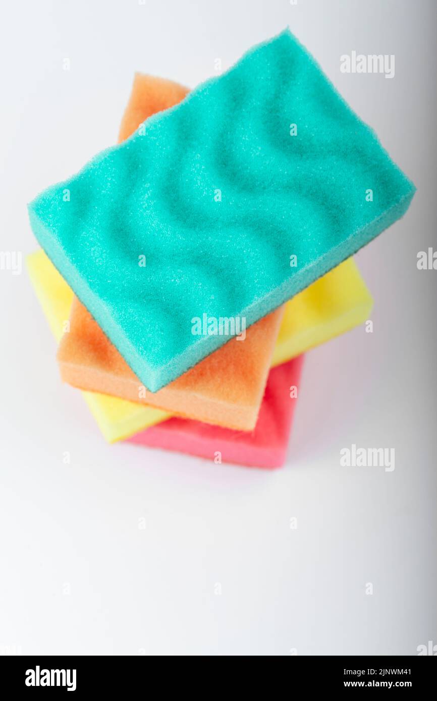Multi-colored sponges for dishes close up on a white background Stock ...
