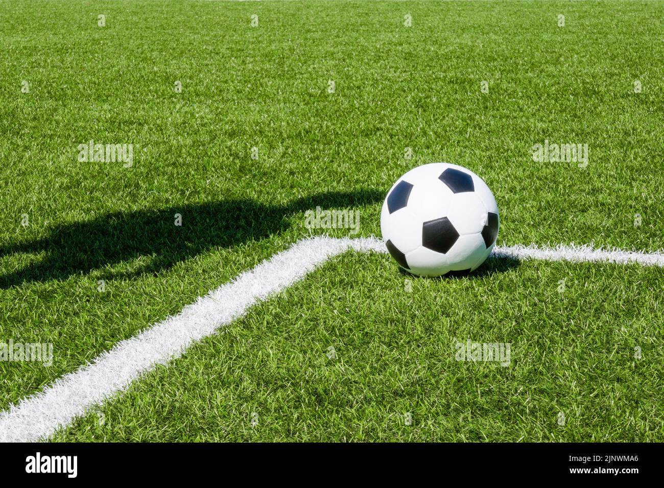 Soccer football sport background. Soccer ball and shadow of player on ...