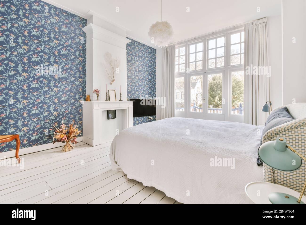 Stylish home interior design of spacious living room with large windows ...