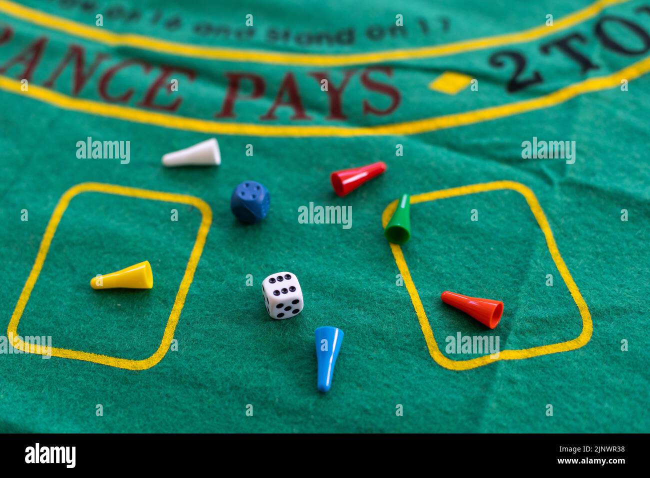 Colorful game chips and two dices. Entertainment. Family games, concept ...