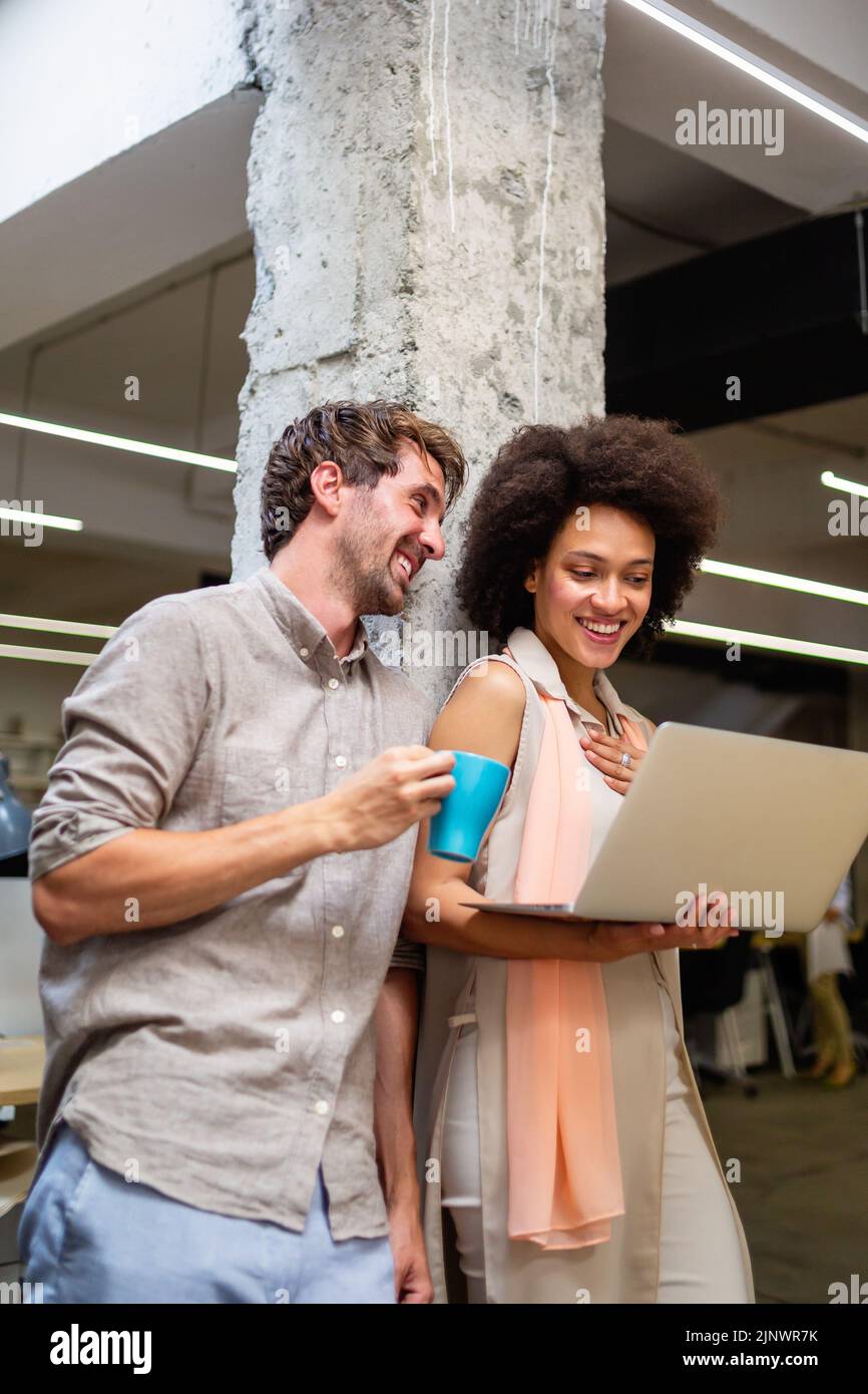 Group of happy multiethnic business people having fun and chatting at ...