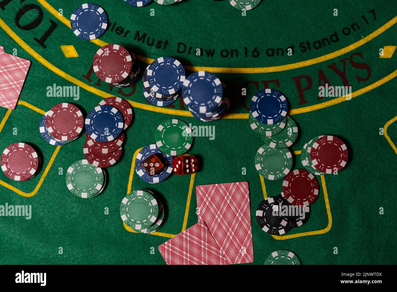 Blackjack playing cards and casino poker chips Stock Photo - Alamy