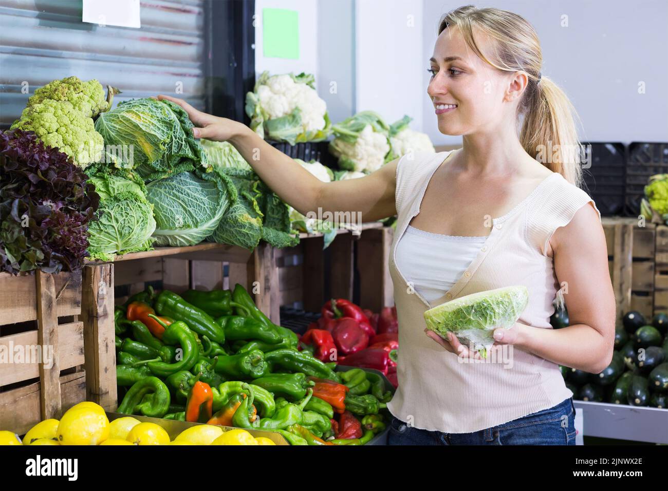 glad young woman shopping fresh cabbage Stock Photo - Alamy