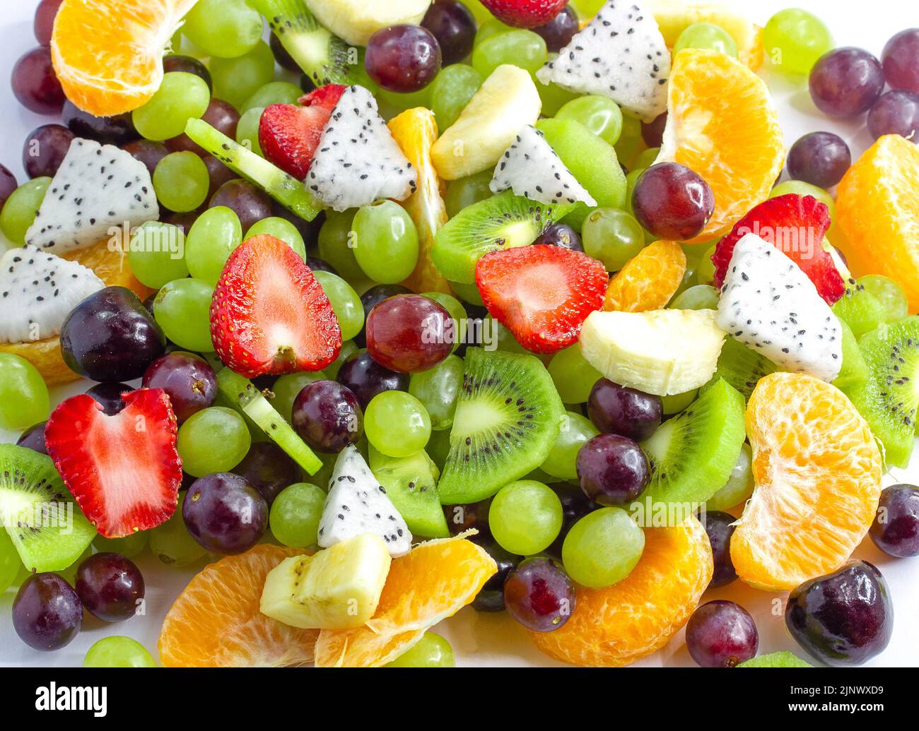 Healthy fresh fruit salad on white background. Top view.Fruit ...