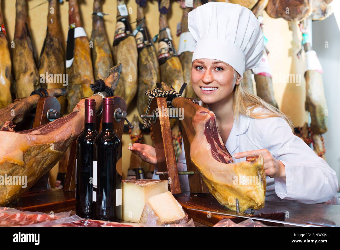 woman in uniform working with meat Stock Photo - Alamy