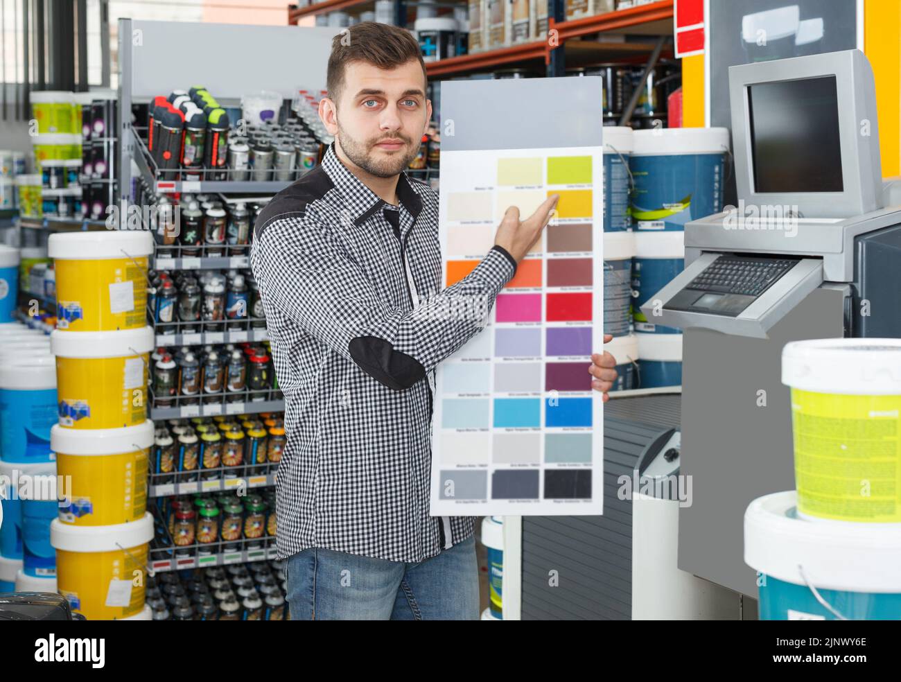 guy looking samples of color at palette Stock Photo - Alamy