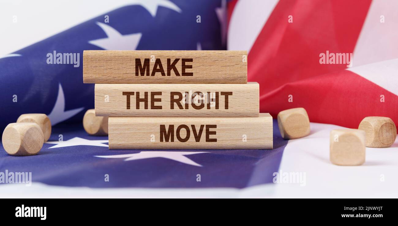 Business concept. The American flag has wooden cubes and plaques that ...