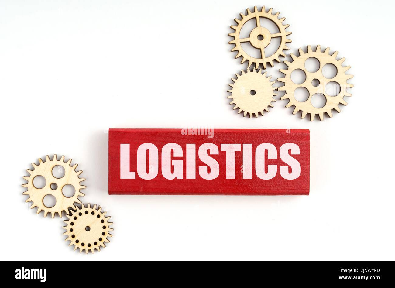 Business concept. On a white background, gears and jenga with the ...