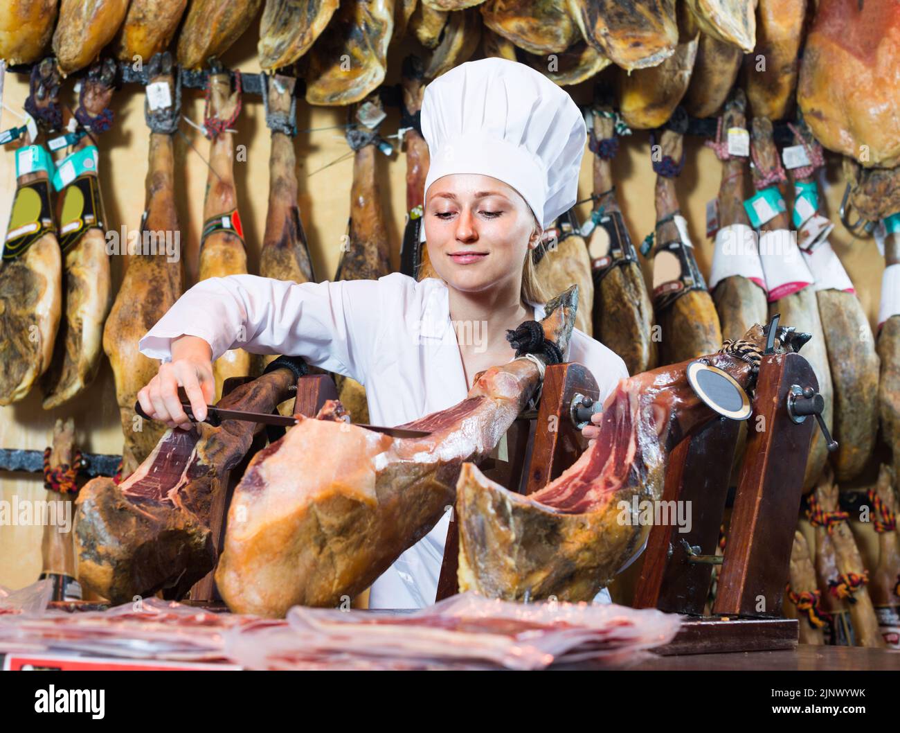 woman cutting dried ham Stock Photo - Alamy