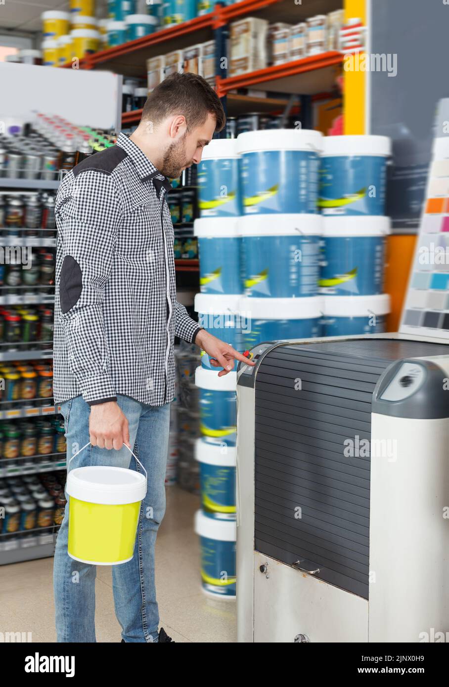 Adult customer standing near technical computer Stock Photo - Alamy