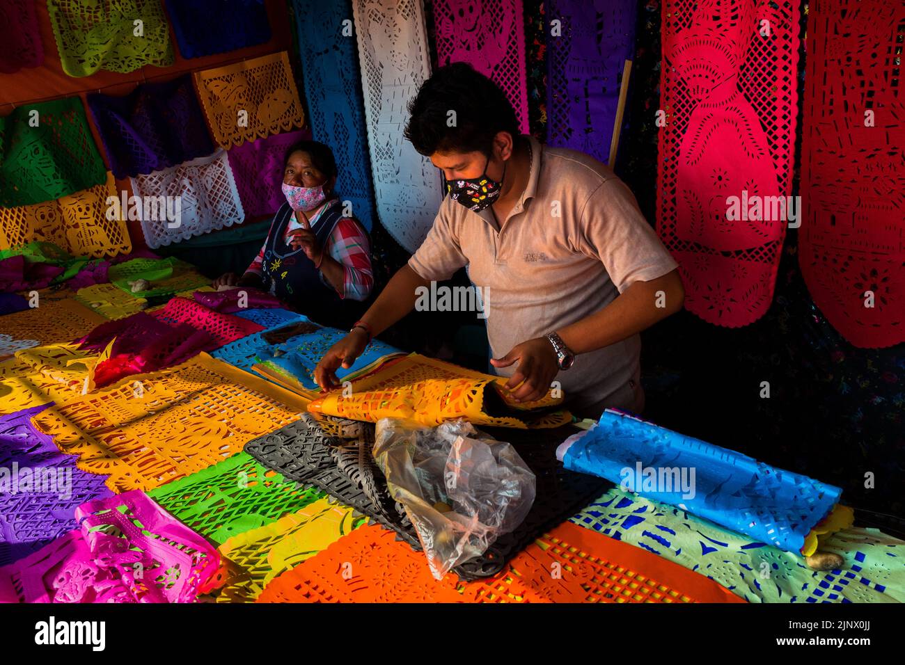 Mexican indigenous family members sell chiseled paper flags for the Day ...
